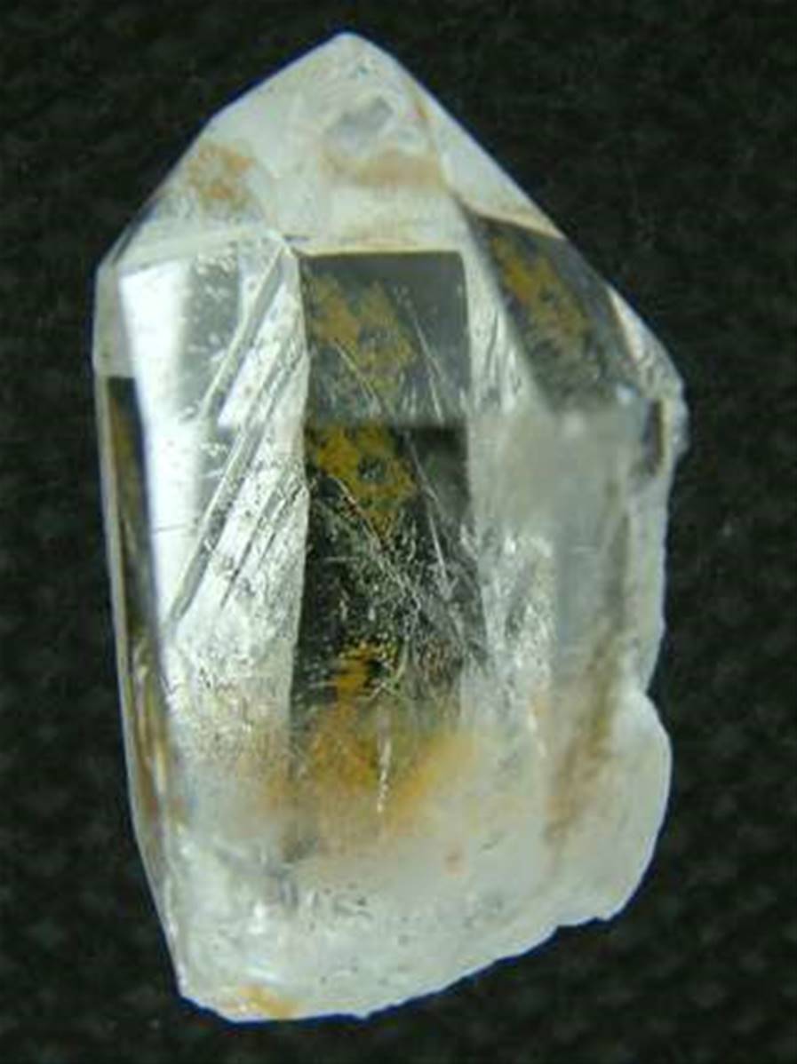 QUARTZ POINT SPECIMEN FEATURING IRON STAINING. 49 X 31 X 24MM APROX ...